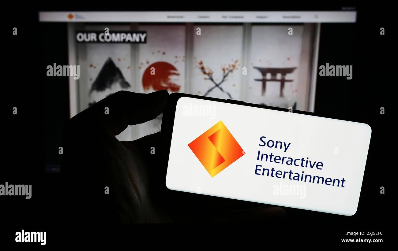 Stuttgart, Germany, 02-14-2024: Person holding mobile phone with logo ...