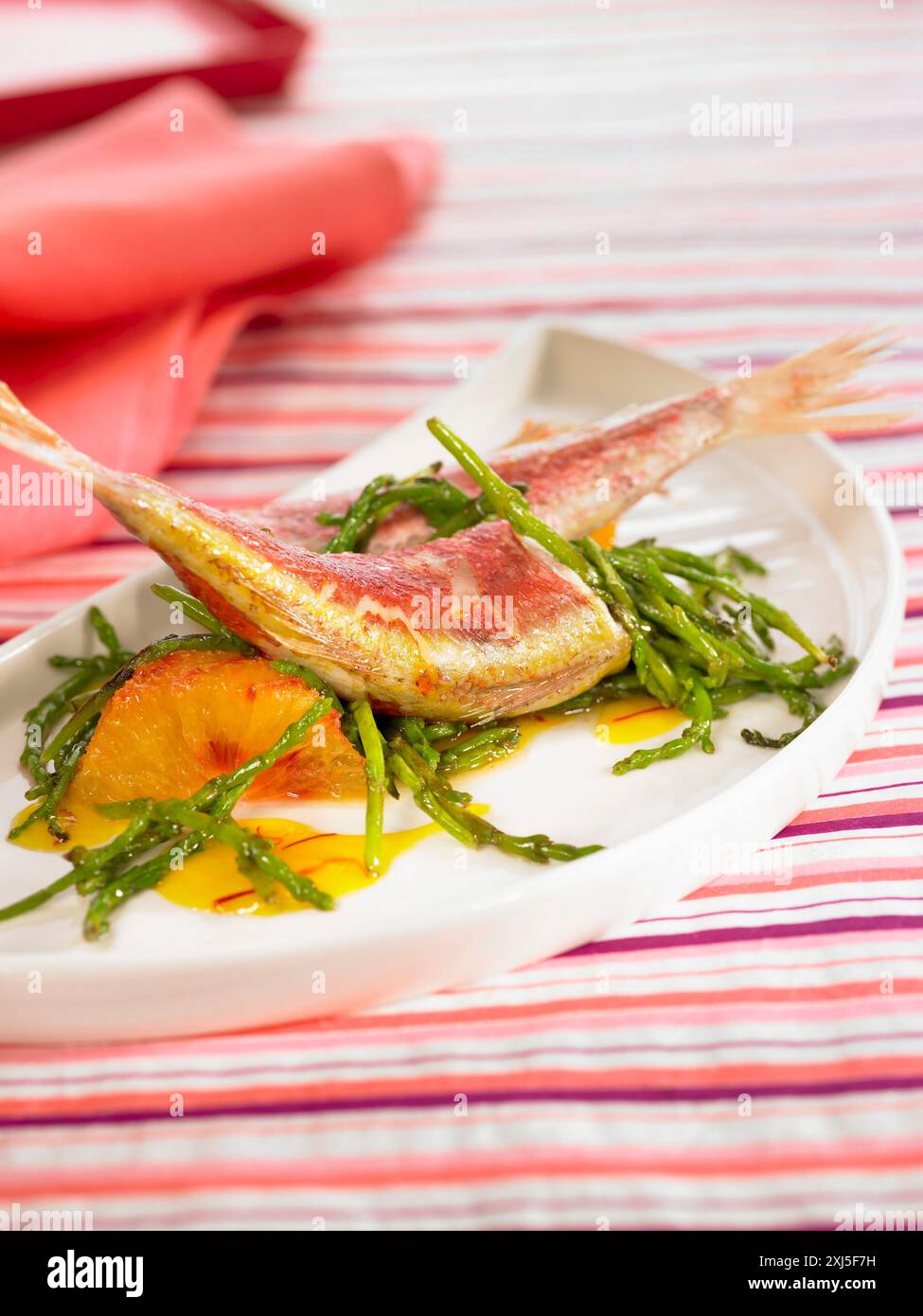 Small salmon with seaweed,oranges and saffron sauce Stock Photo - Alamy
