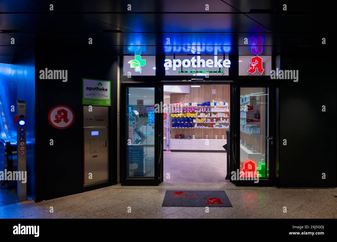 Night shot, pharmacy city centre, logo, subway, escalator, neon light ...