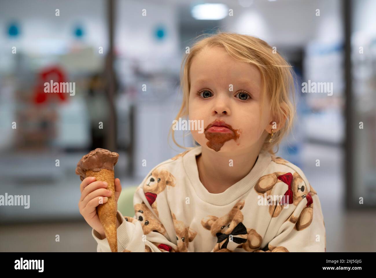 Interior shot, girl, 2-3 years, blonde, eating chocolate ice cream, ice ...