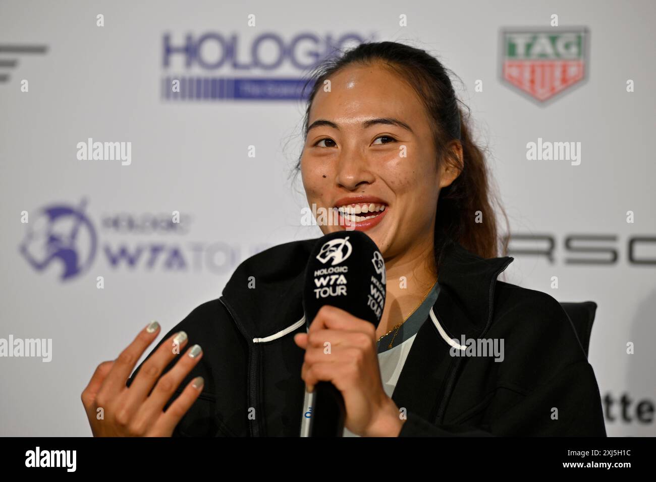 Qinwen Zheng (CHN) portrait, smiles, microphone, mike, logo, WTA, press ...