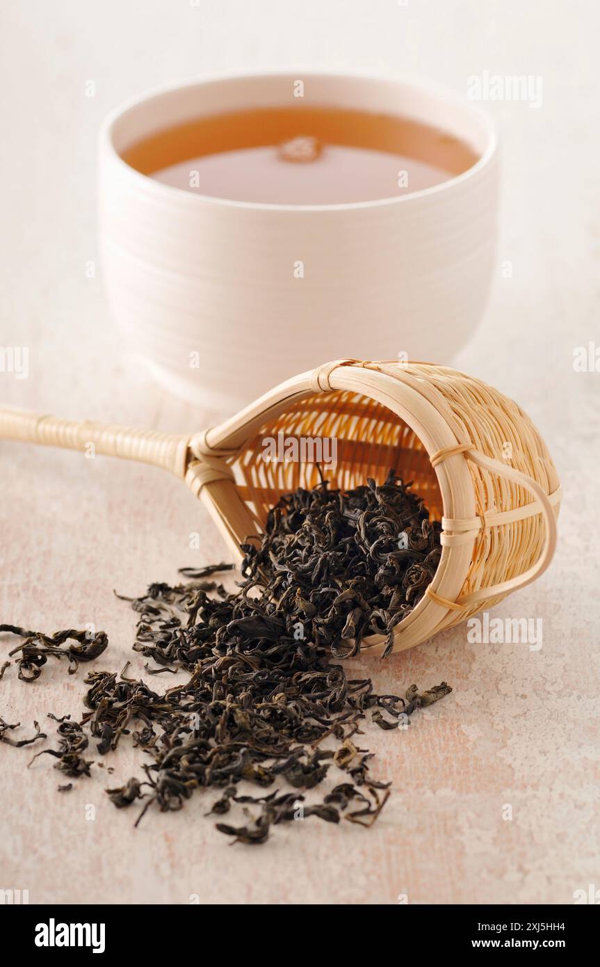 Chinese tea sieve and cup of tea Stock Photo - Alamy