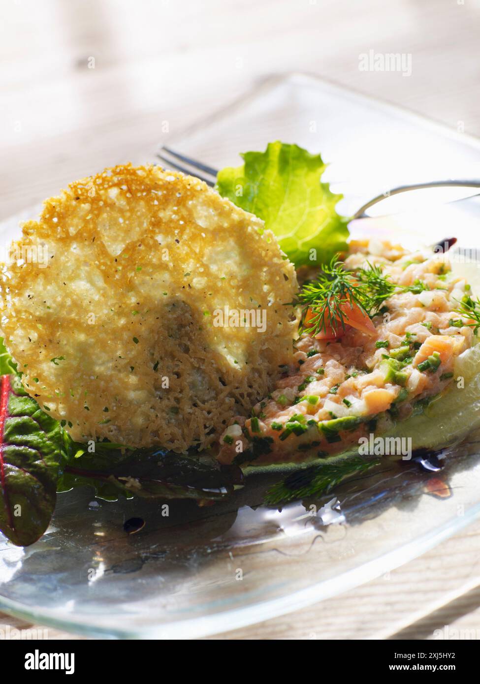 Two fish tartare with parmesan tuile biscuits Stock Photo - Alamy
