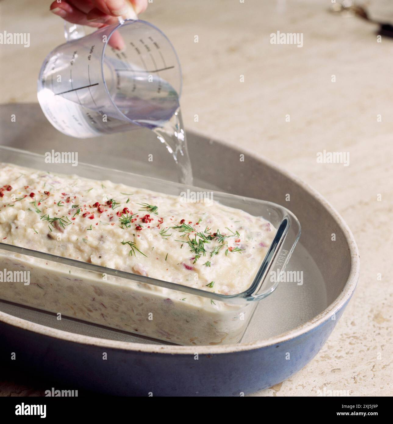 Preparing a Bain-marie to cook the terrine Stock Photo - Alamy
