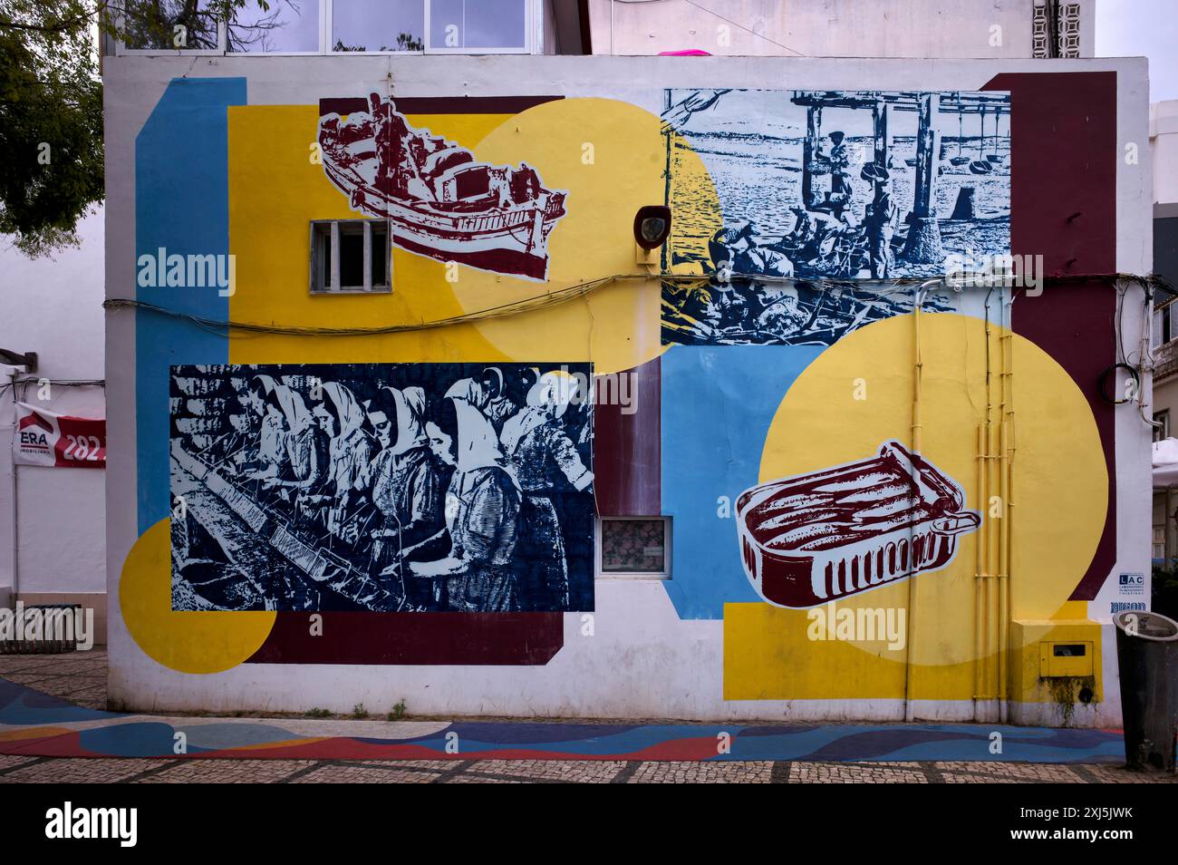 Wall painting, graffiti, illustrating the history of the sardine processing industry, Portimao ...