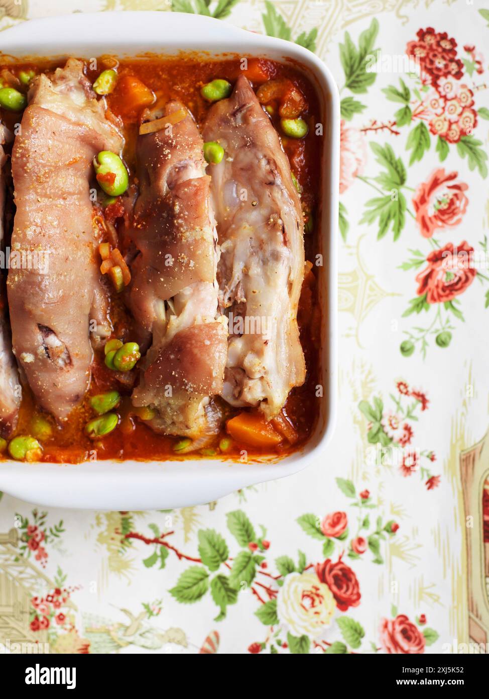 Pig's trotters in tomato Stock Photo - Alamy