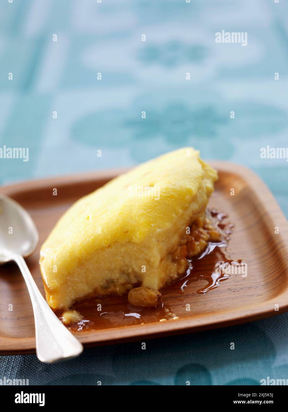 Caramel and raisin polenta pudding Stock Photo - Alamy