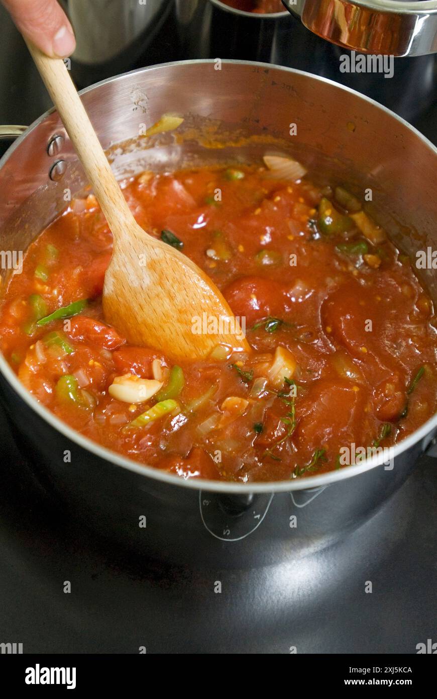 Preparing tomato sauce Stock Photo - Alamy