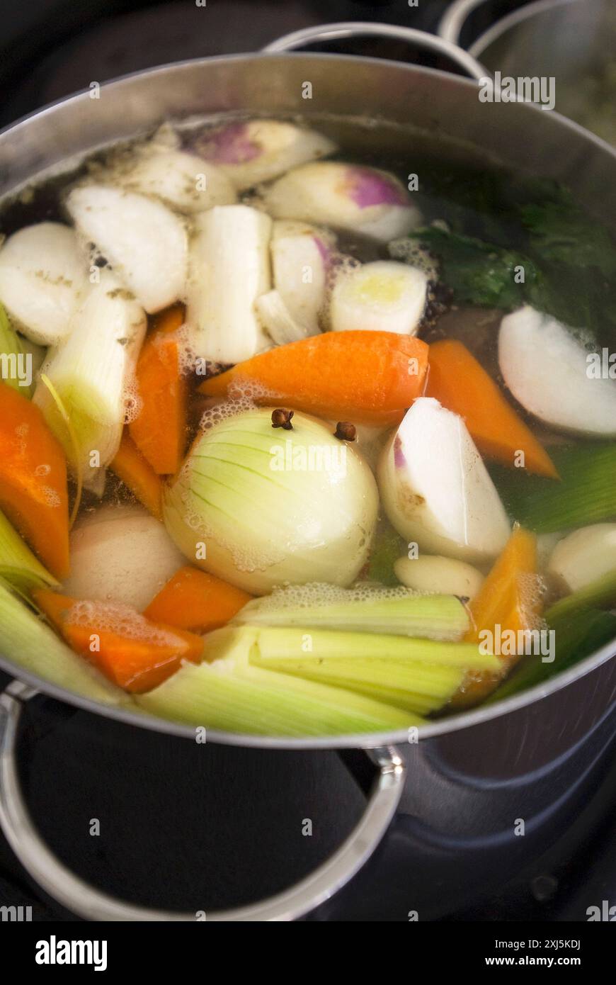 Cooking the vegetables for the court-bouillon Stock Photo - Alamy