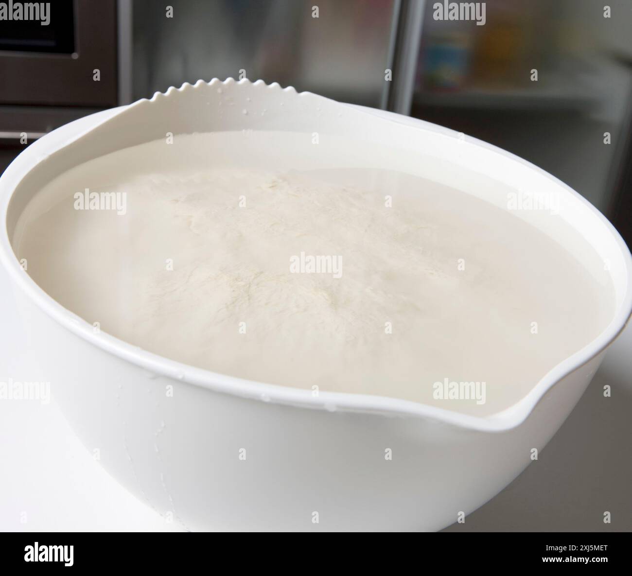 Leaving the dough to rest covered with water Stock Photo - Alamy