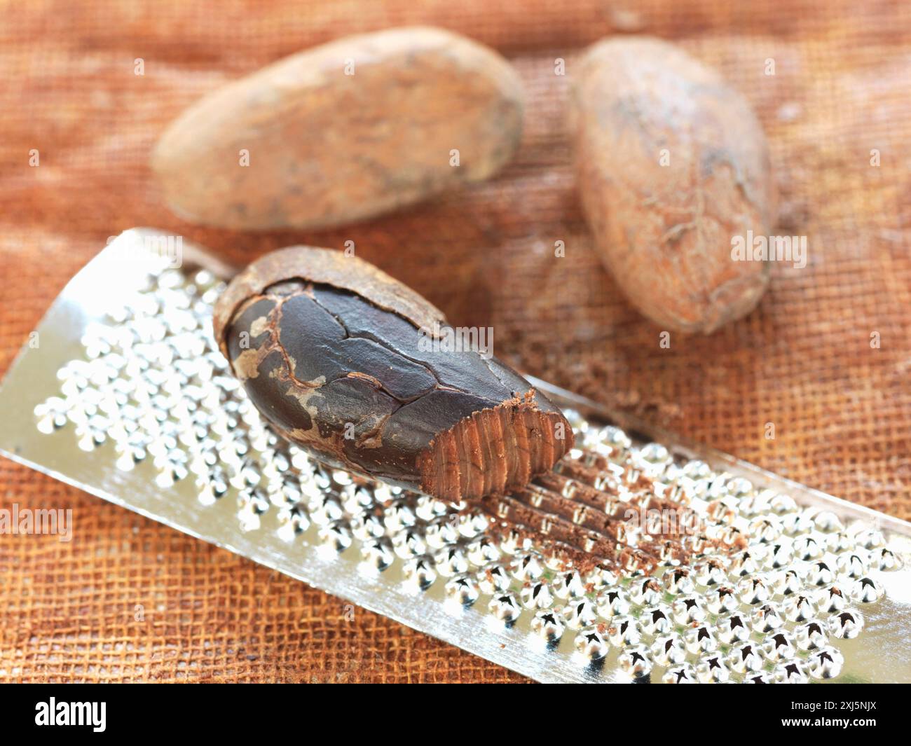 Grating a cocoa bean Stock Photo - Alamy