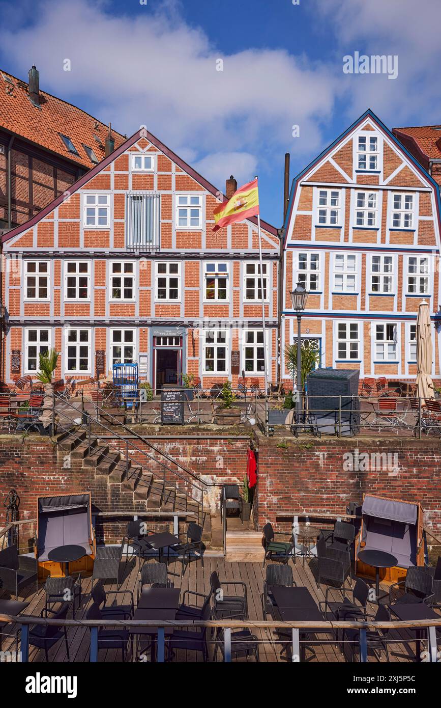 Historic half-timbered houses, stairs and a pontoon with a catering ...