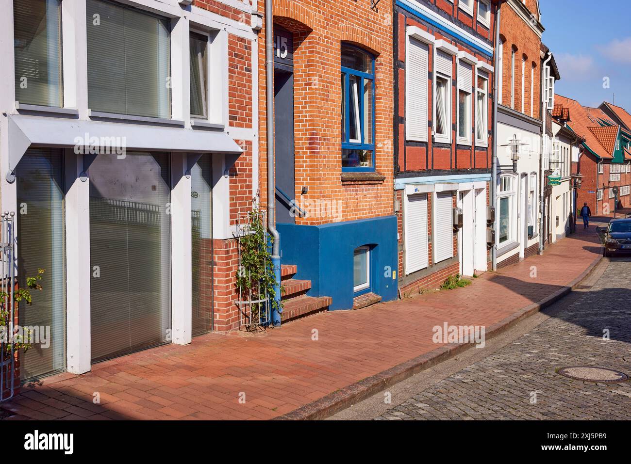 Facades of different architectural styles, old half-timbered houses and ...