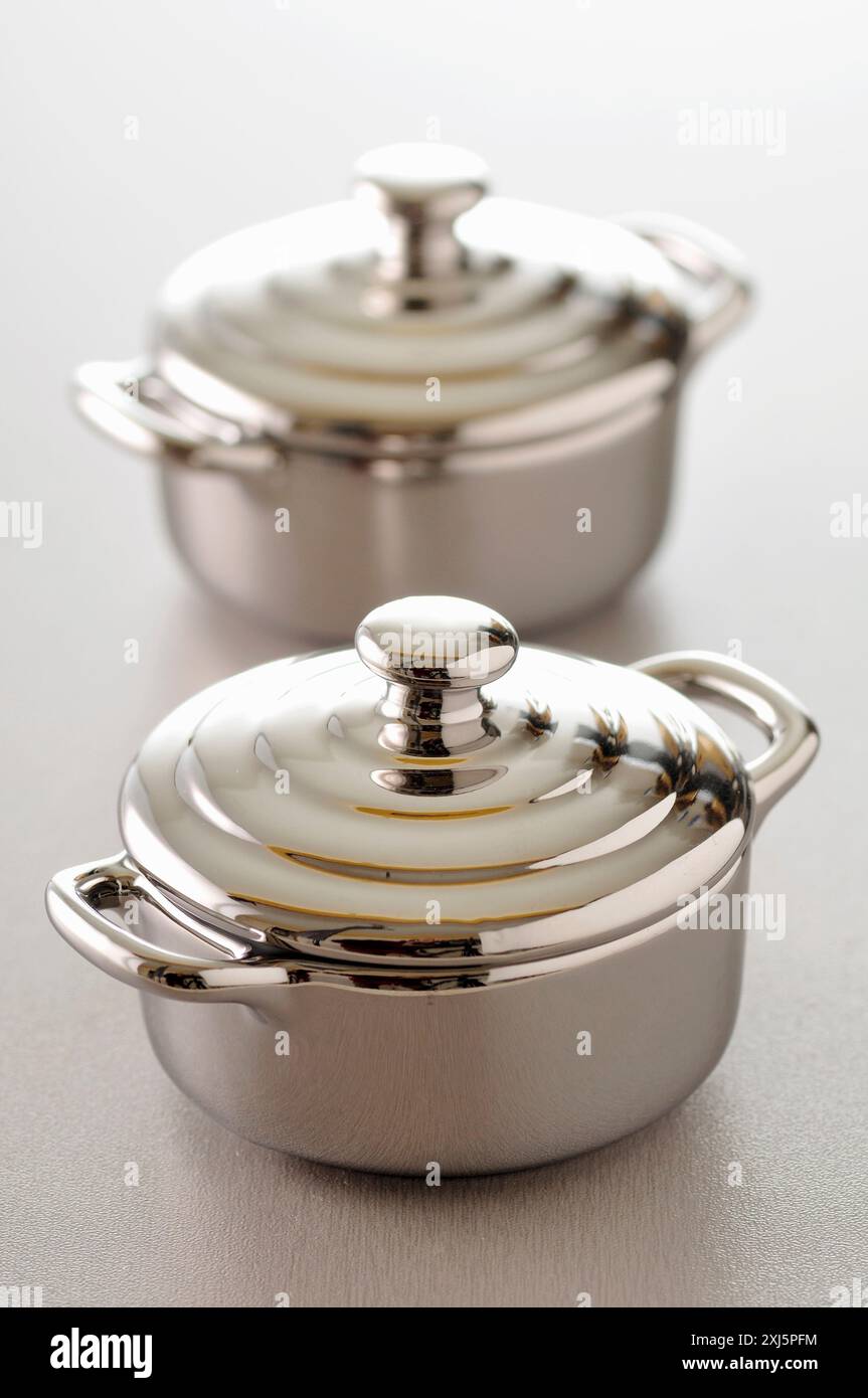 Stainless steel individual cooking pots Stock Photo - Alamy