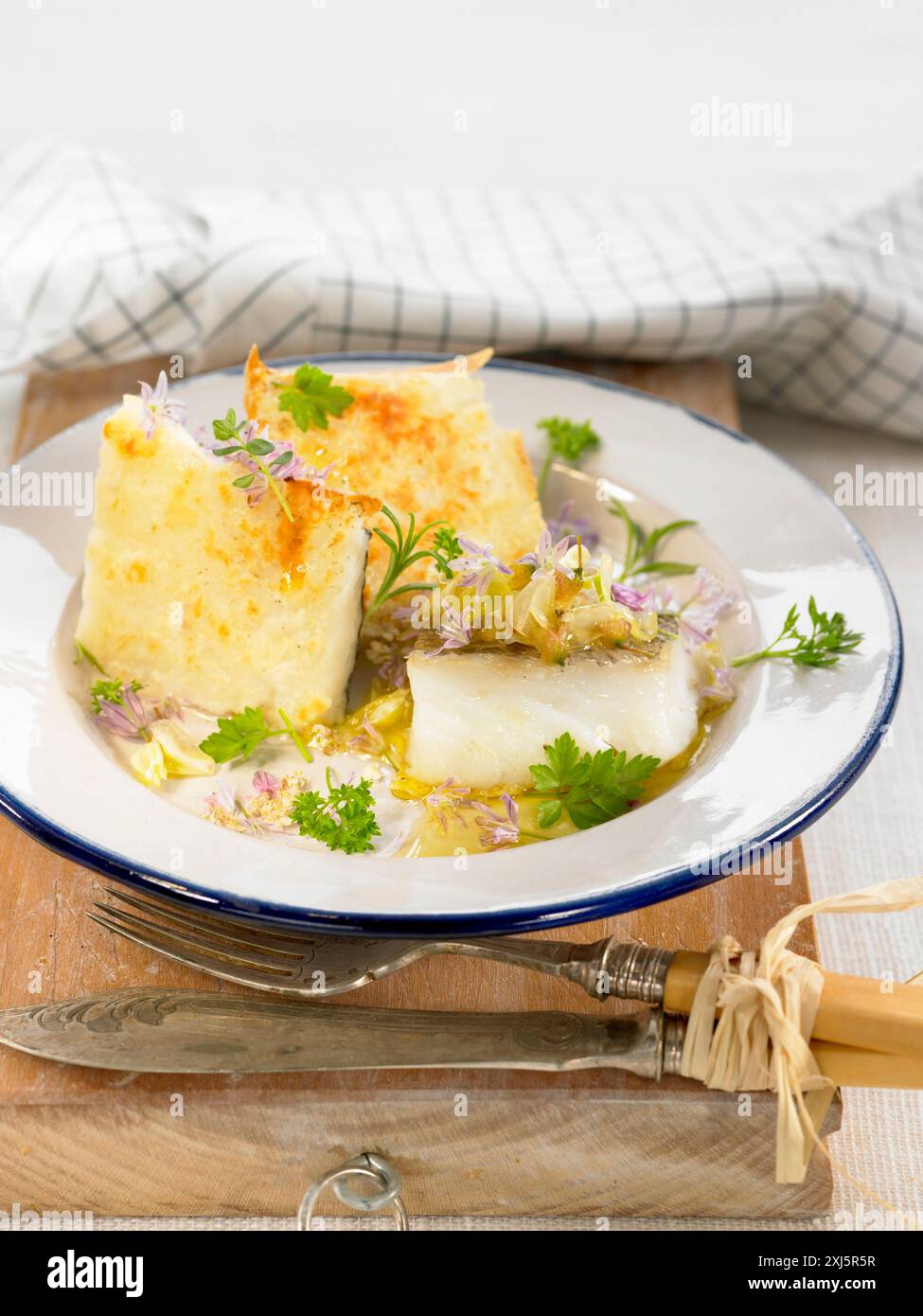 Salt-cod with rosemary flowers and chives Stock Photo - Alamy