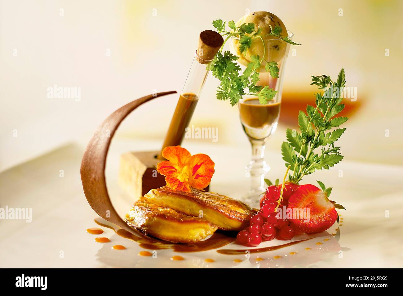 Pan-fried foie gras with edible flowers,fruit and herbs Stock Photo - Alamy