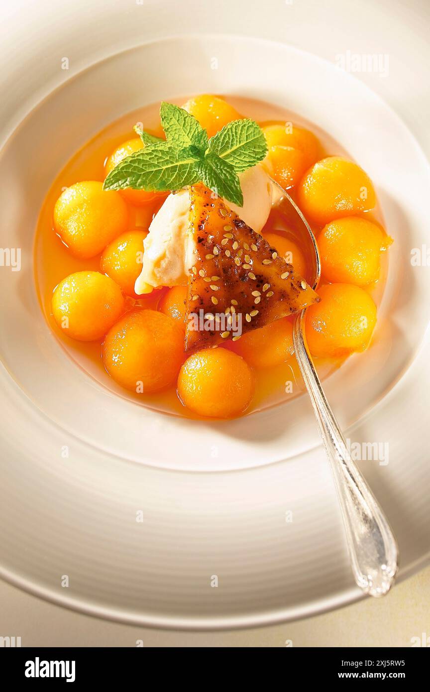Melon ball soup with Muscat,peach sorbet and caramel with sesame seeds ...