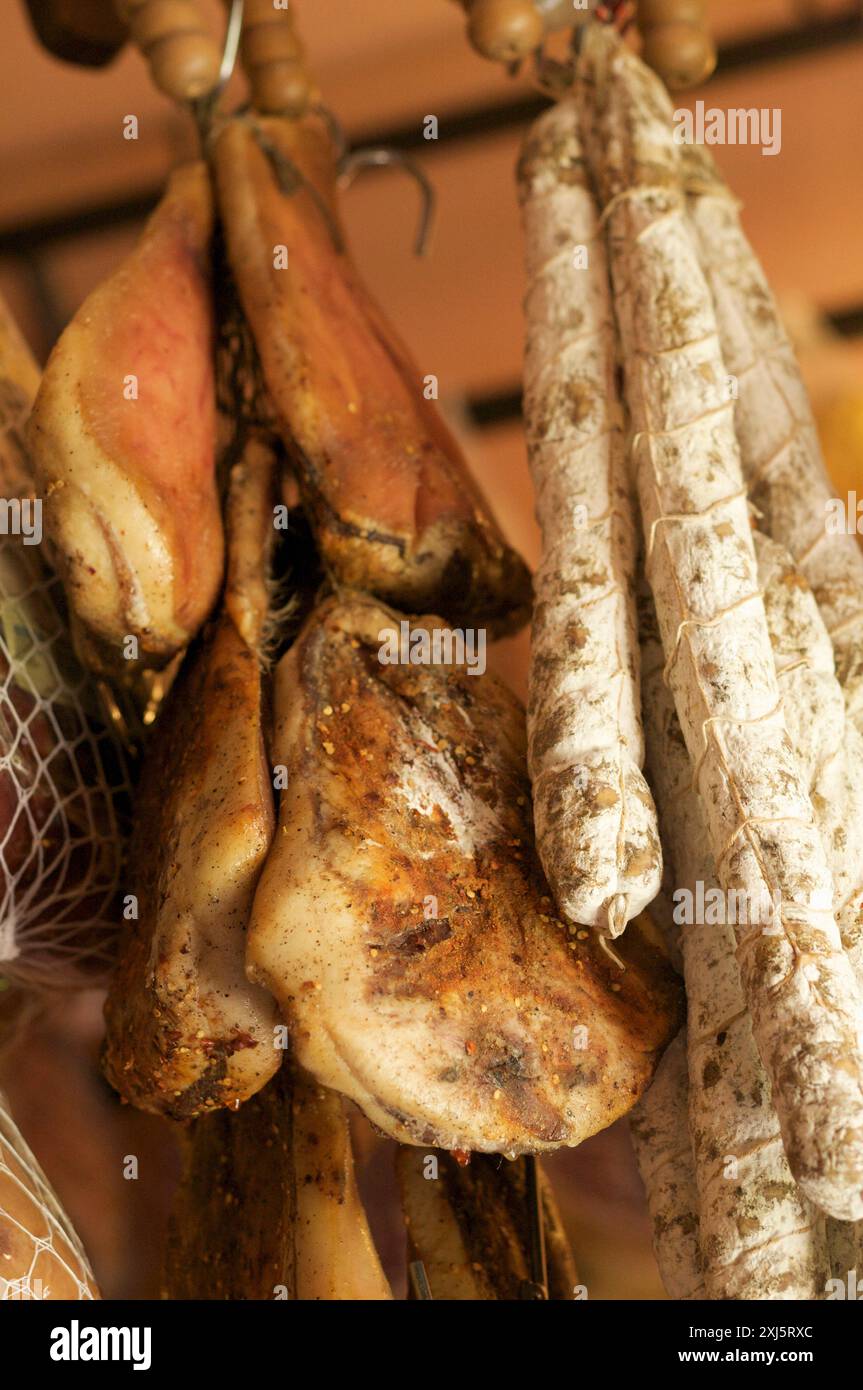 Cooked pork meats hanging in a stall Stock Photo - Alamy