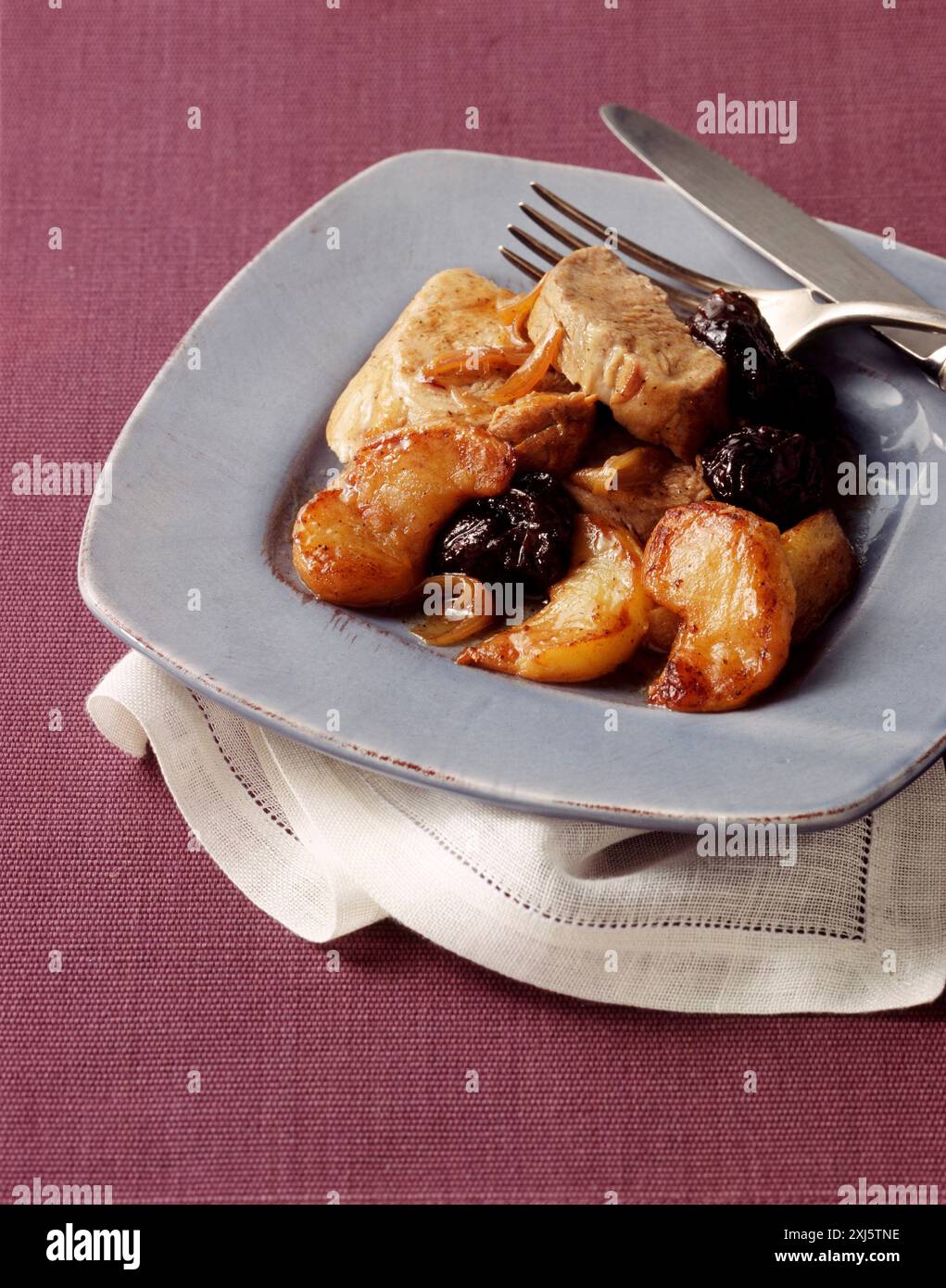 Pork filet mignon with apples and prunes Stock Photo - Alamy