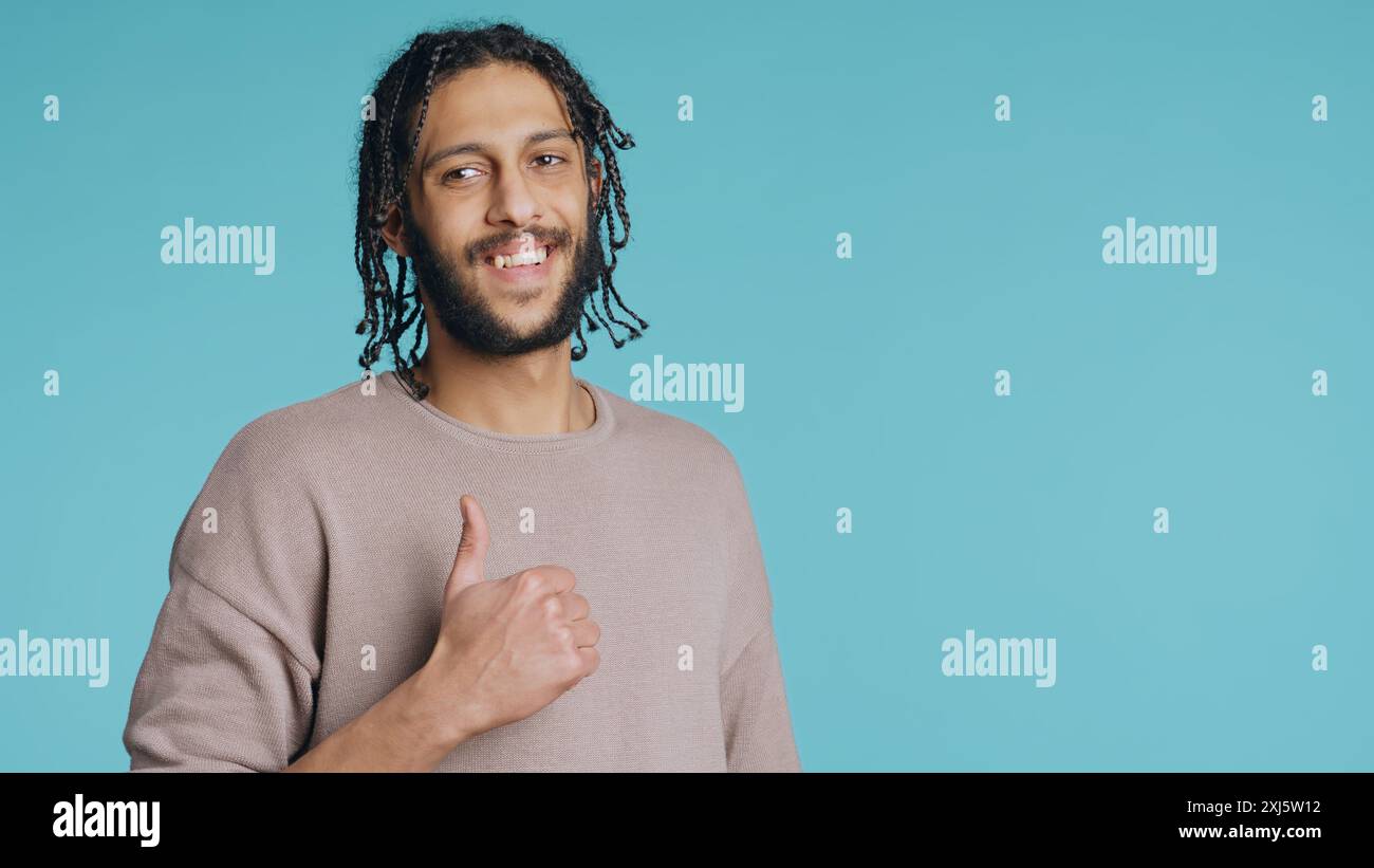 Man doing thumbs up hand gesturing, showing approval, having positive ...