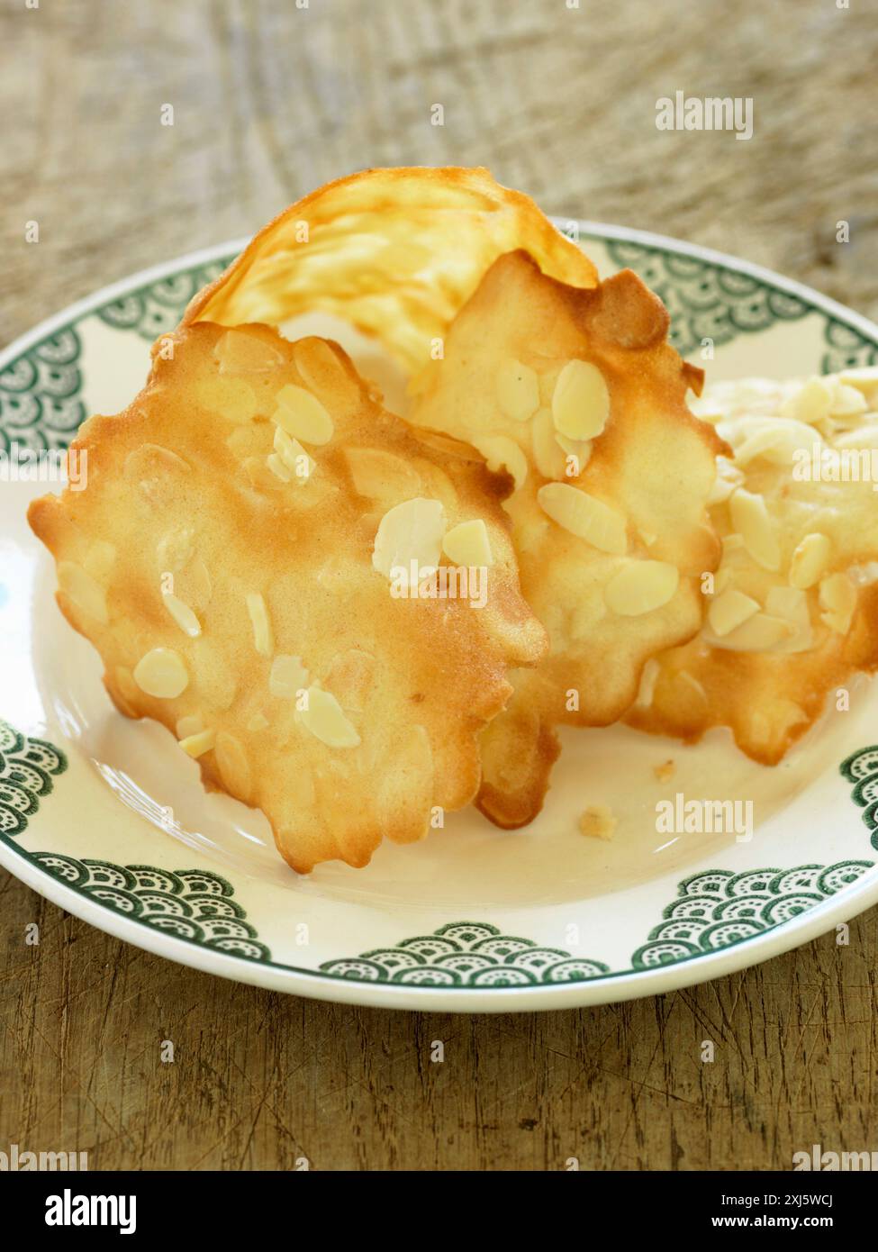 Almond tuile biscuits Stock Photo - Alamy
