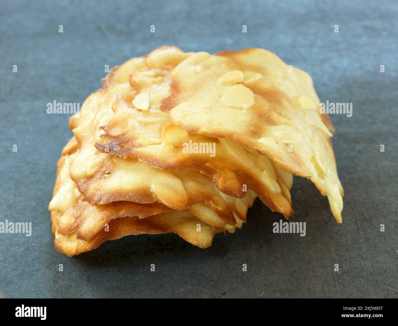 Almond tuile biscuits Stock Photo - Alamy