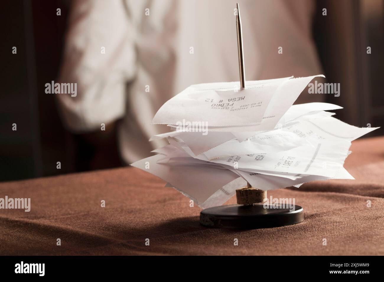 Bills on a pike in a restaurant Stock Photo - Alamy