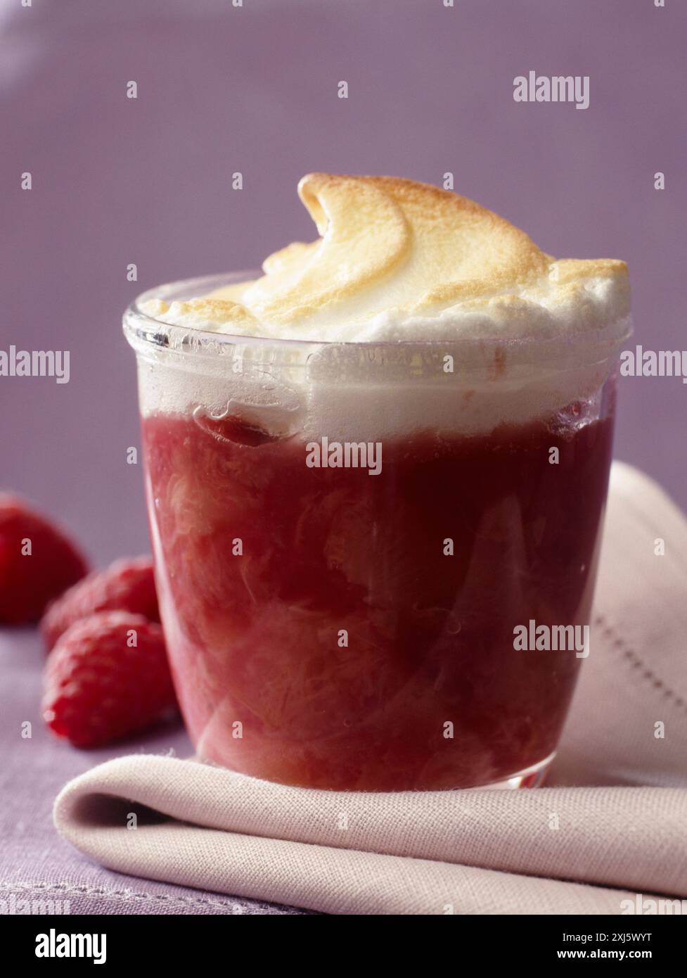 Raspberry and rhubarb compote with meuringue topping Stock Photo - Alamy