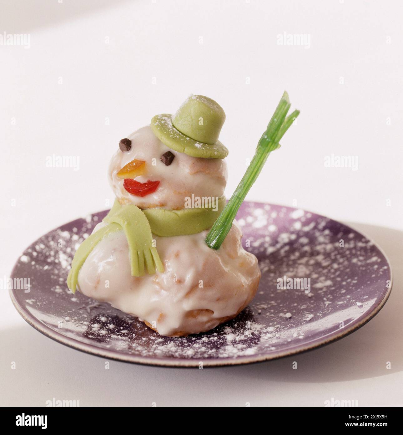 Snow-man shaped cream puffs with almond paste and cnadied angelica ...