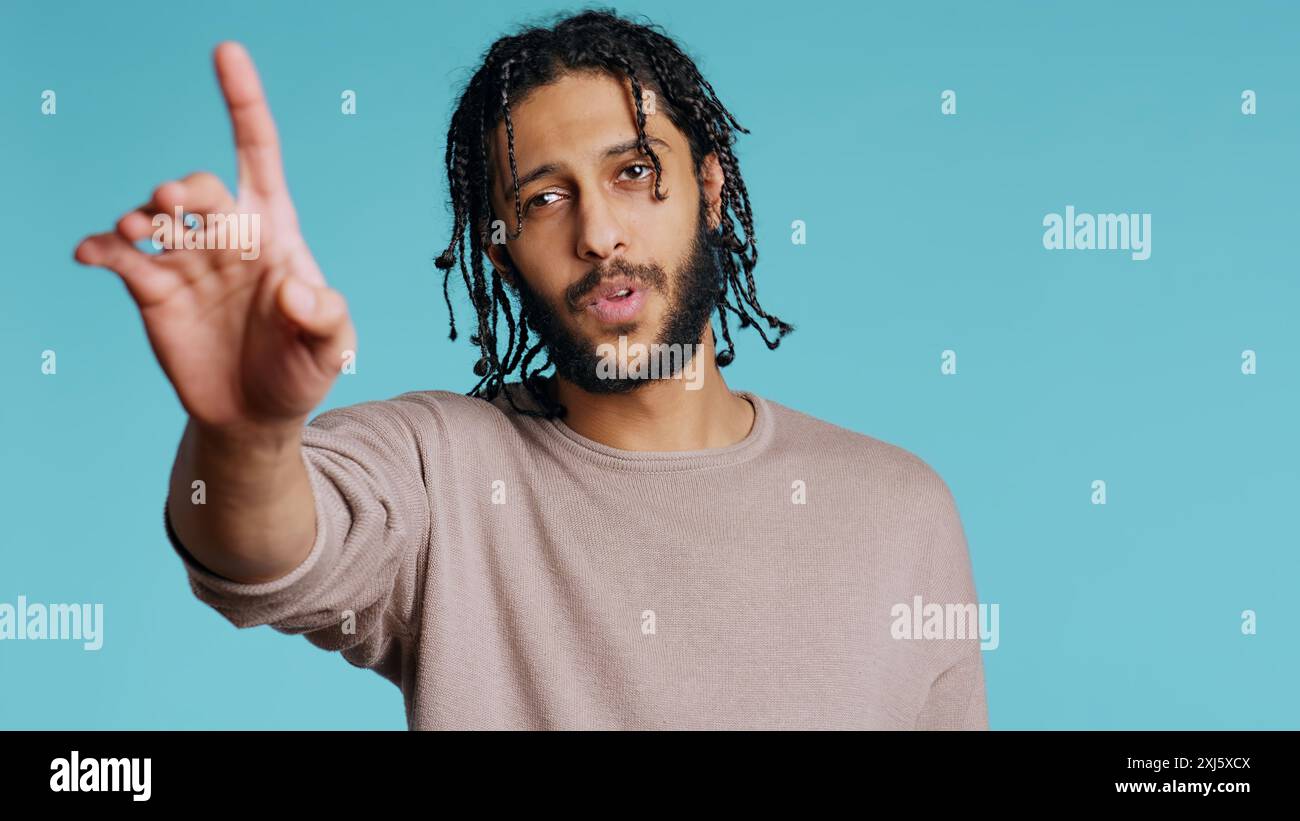 Middle eastern man gestures hi-res stock photography and images - Alamy