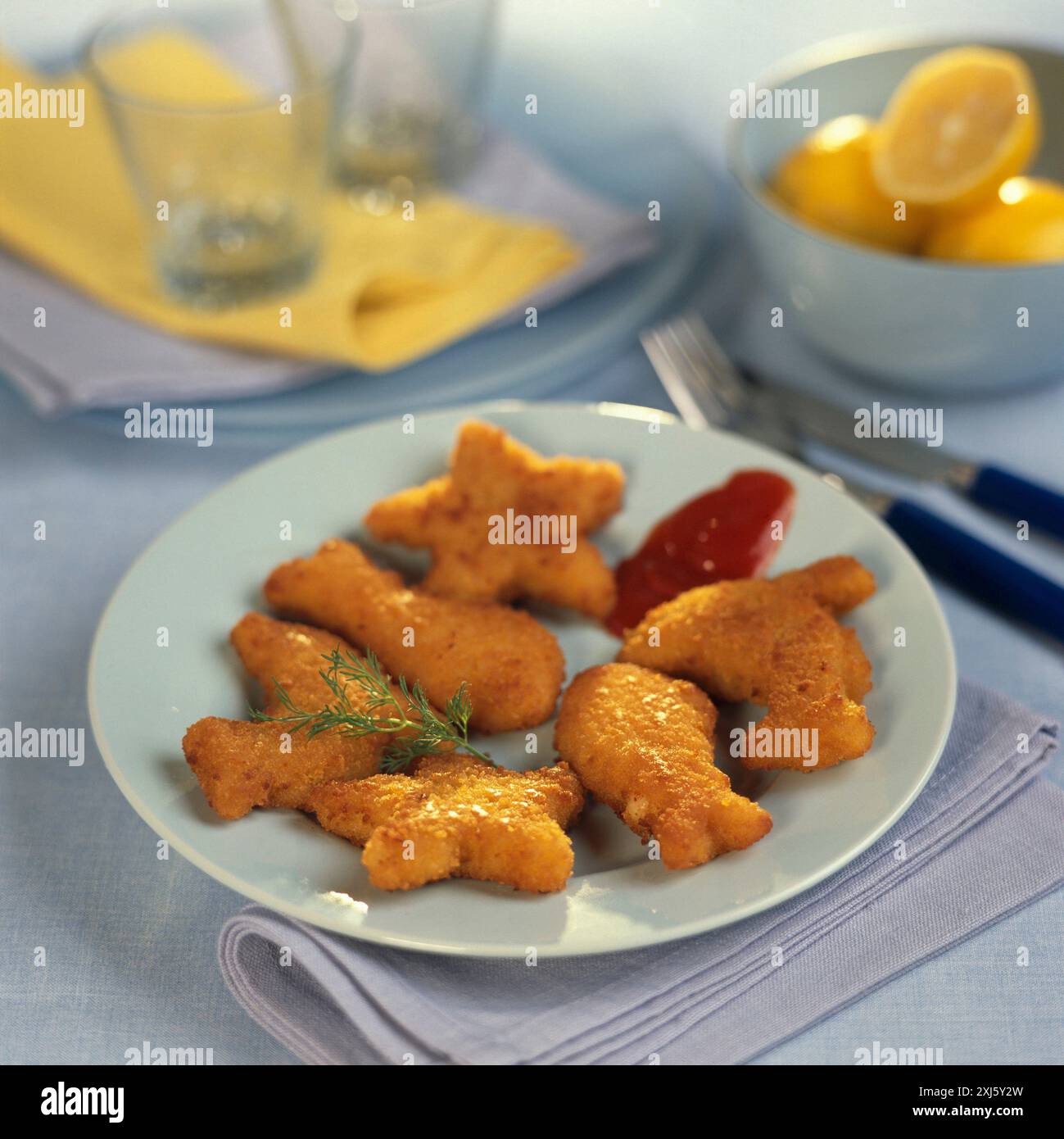 Fish-shaped fish fingers Stock Photo - Alamy