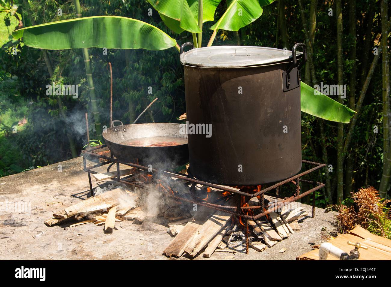 Pot with soot on a wood stove - Typical Colombian tradition Stock Photo ...