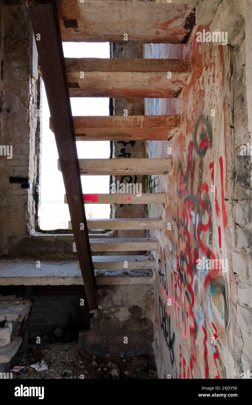 Staircase inside ruined Soviet era lifeguard building on the beach at ...