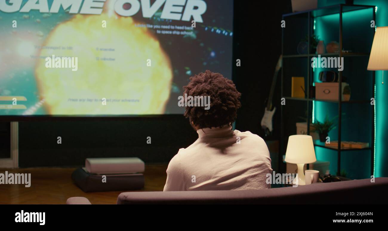 Upset african american gamer raging after losing game, playing on ...