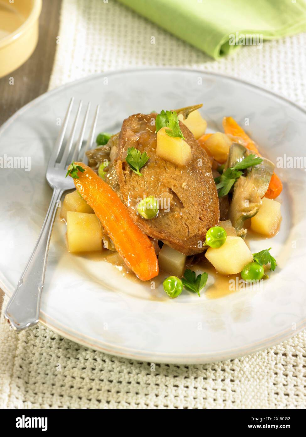 Seitan with spring vegetables Stock Photo - Alamy