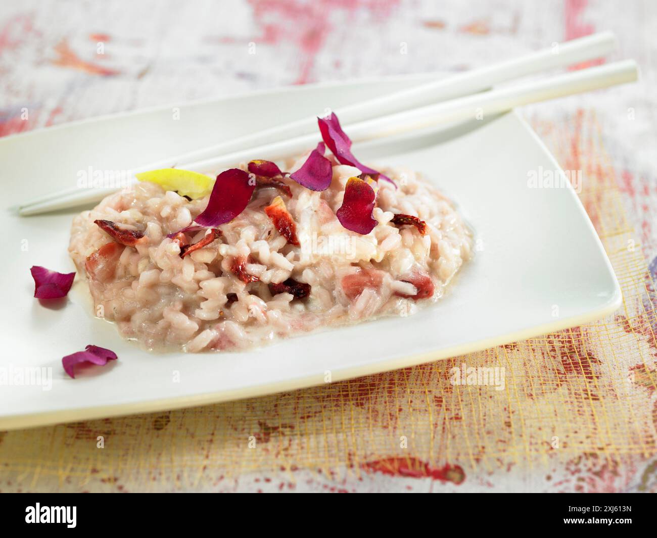 Pink risotto with shalloots and dried strawberries Stock Photo - Alamy