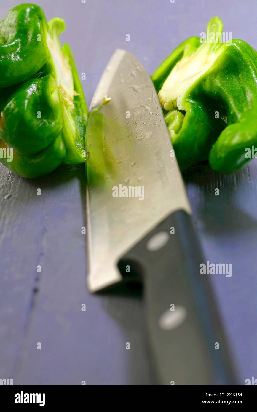 Green pepper cut in half Stock Photo - Alamy