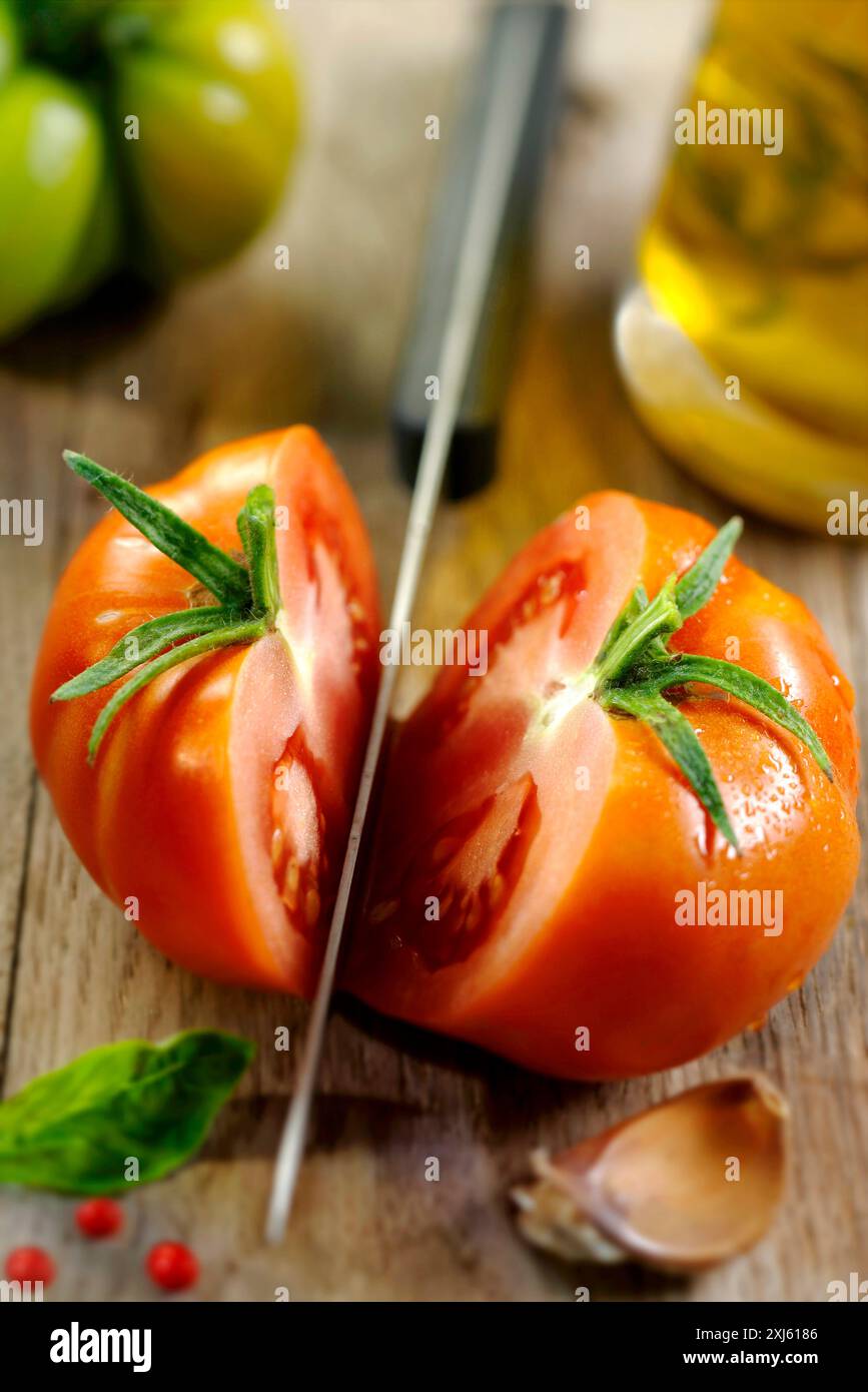 Cut in half tomato hi-res stock photography and images - Alamy