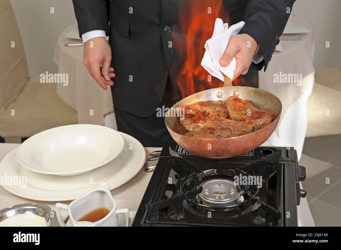 Restaurant flambe table waiter hi-res stock photography and images - Alamy