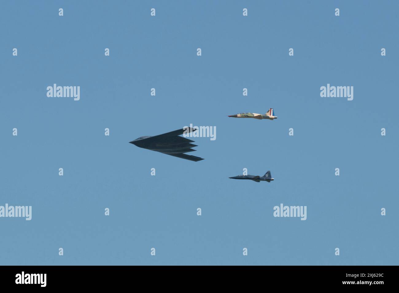 A U.S. Air Force B-2 Spirit stealth bomber and two T-38 Talon aircraft ...