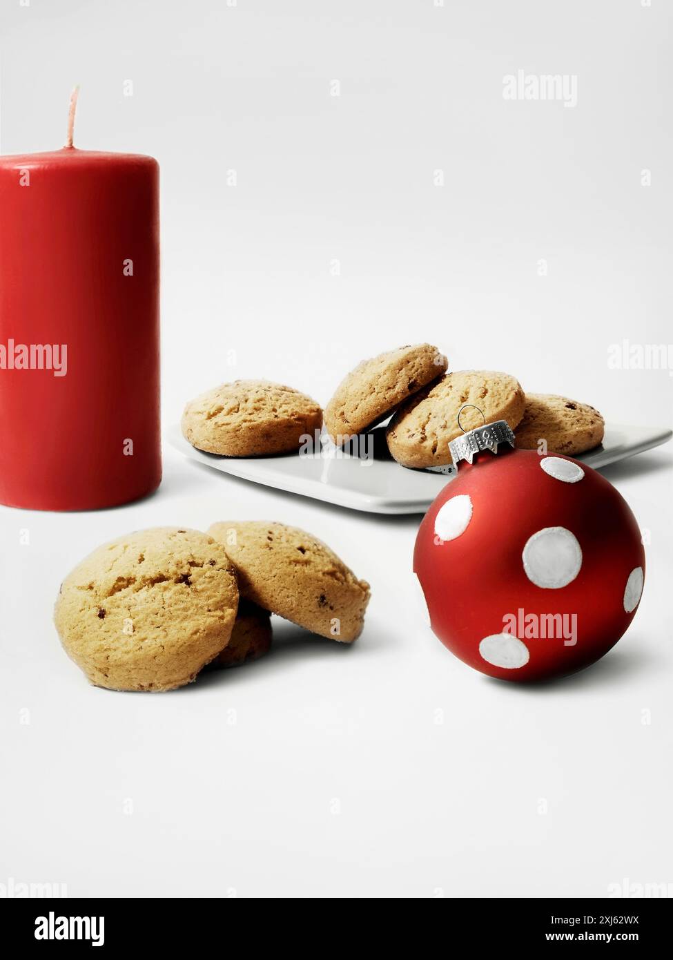 Shortbread cookies with Christmas red ornaments Stock Photo - Alamy