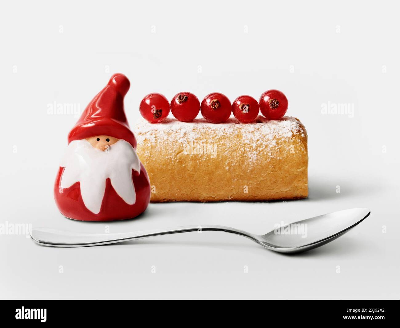 Christmas redcurrant individual log cake with a Santa Claus figurine ...