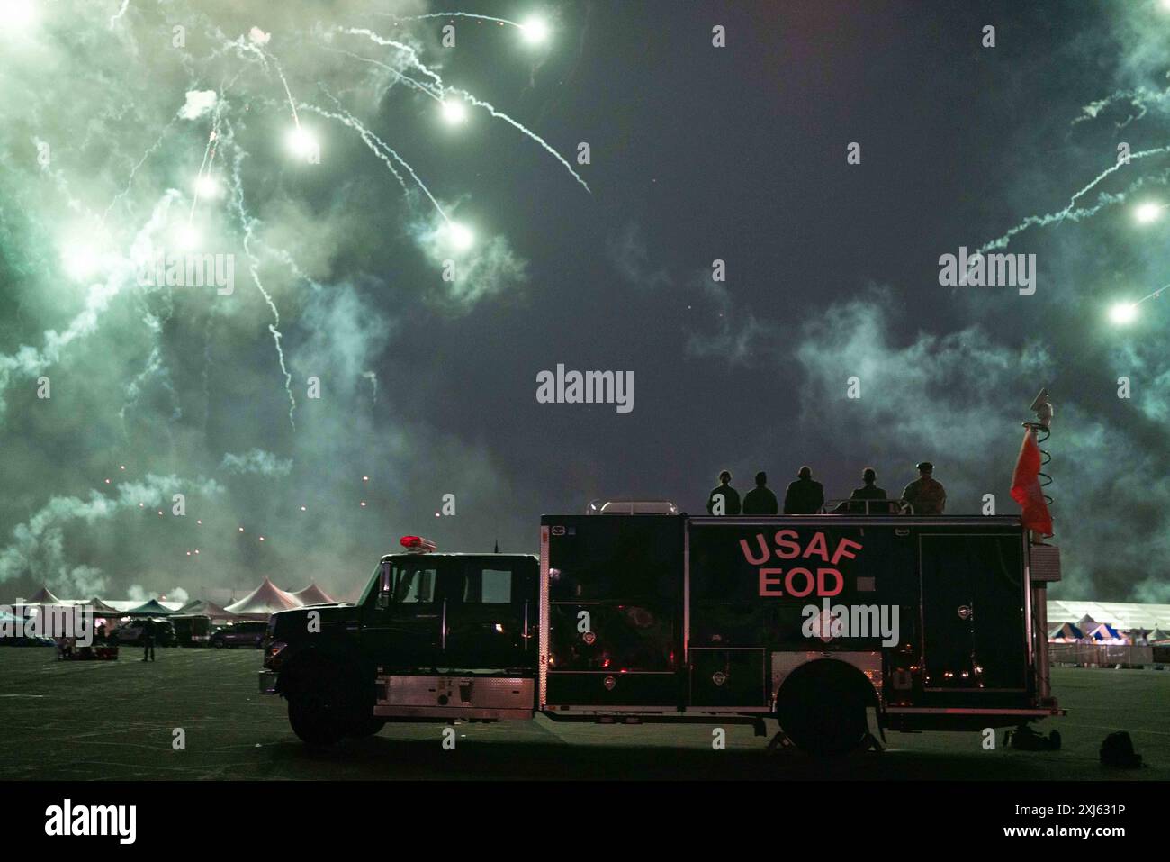U.S. Airmen watch fireworks and a drone show during the California ...