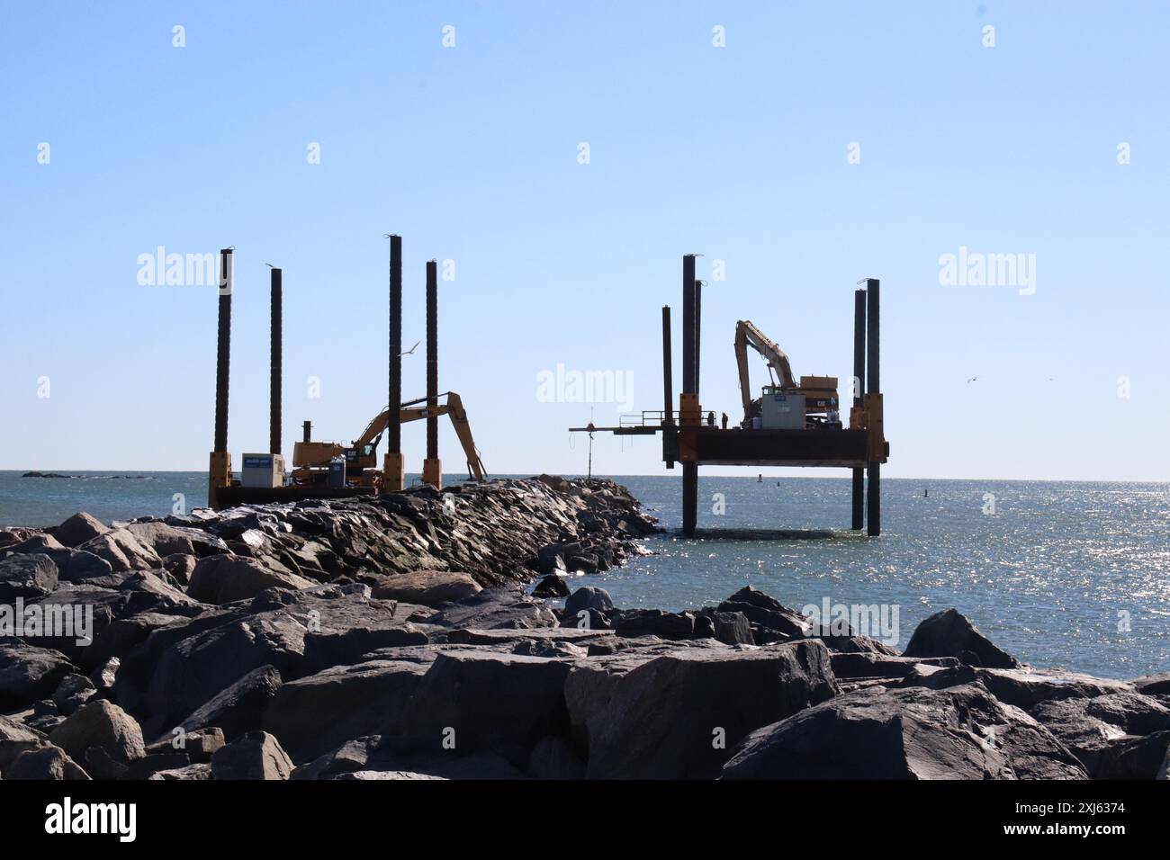 Repair work at the Hampton Harbor North Jetty is ongoing Stock Photo ...