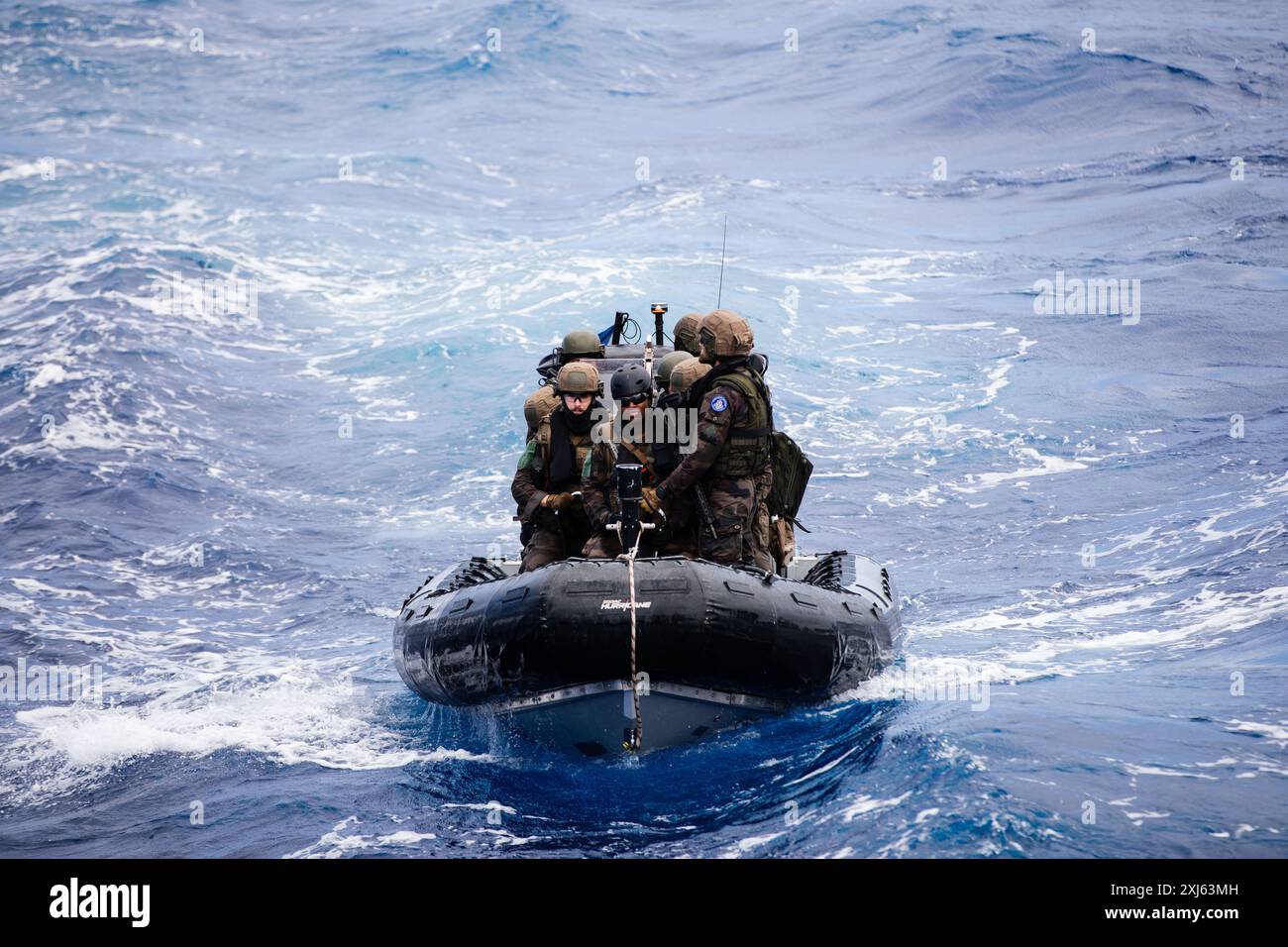 Sailors attached to the French Navy Frigate FS Bretagne (D655) prepare ...