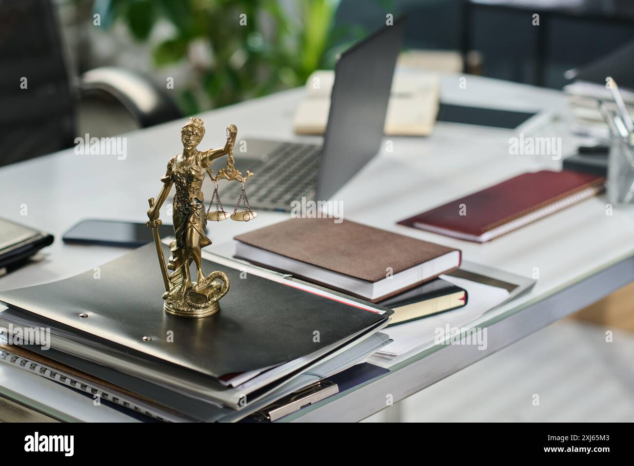 Small statuette of blindfolded goddess of Justice Themis with scale and ...