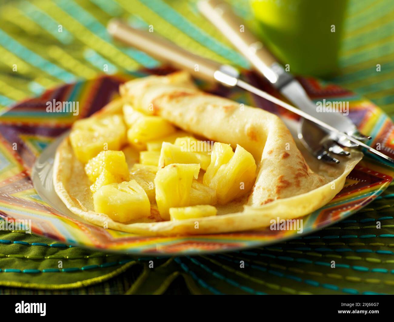 Pancake with stewed pineapple Stock Photo - Alamy