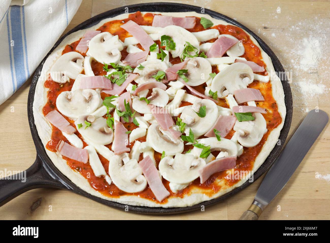 Ham and mushroom Reine pizza before cooking Stock Photo - Alamy