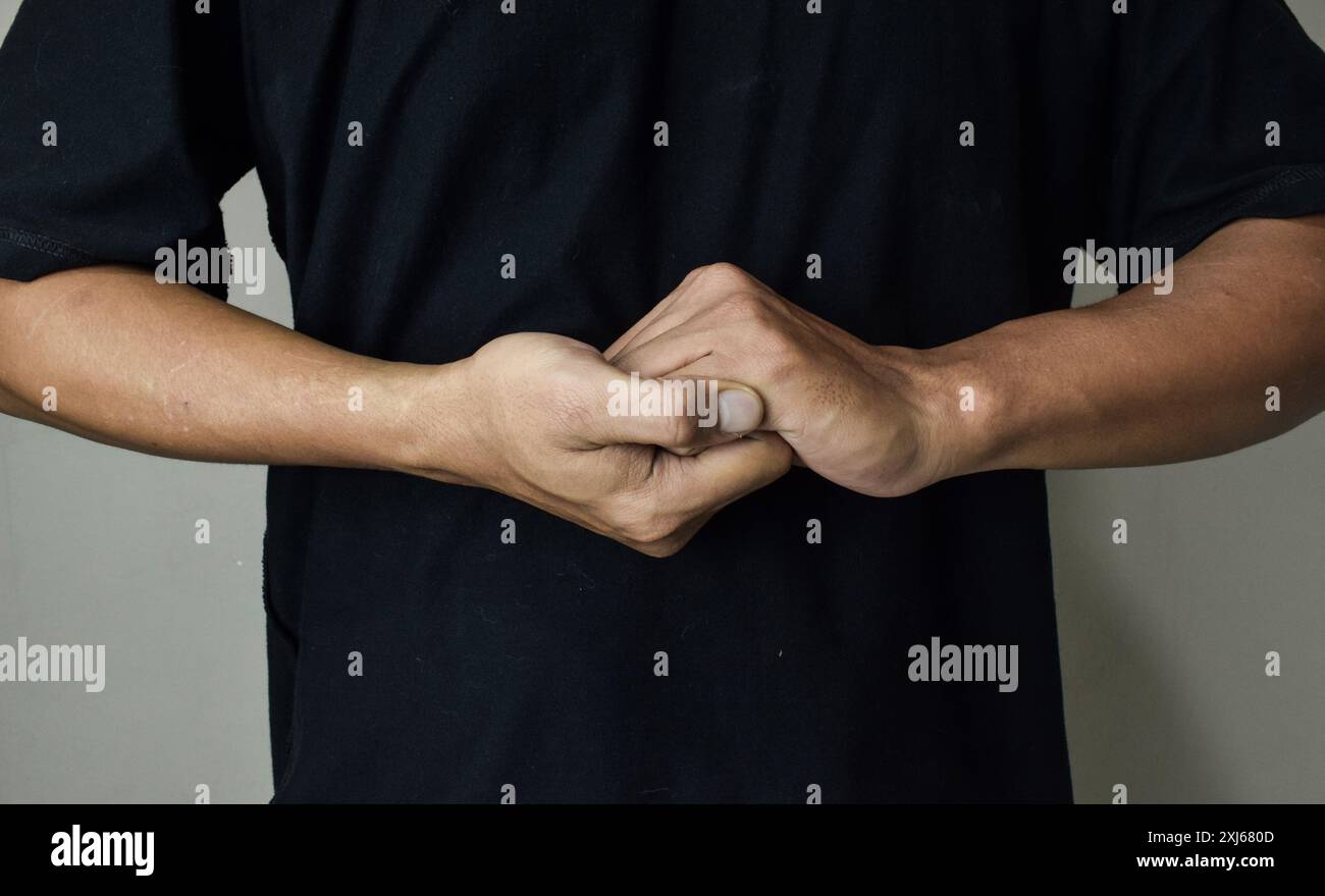Young deaf mute man using sign language on beige background Stock Photo ...