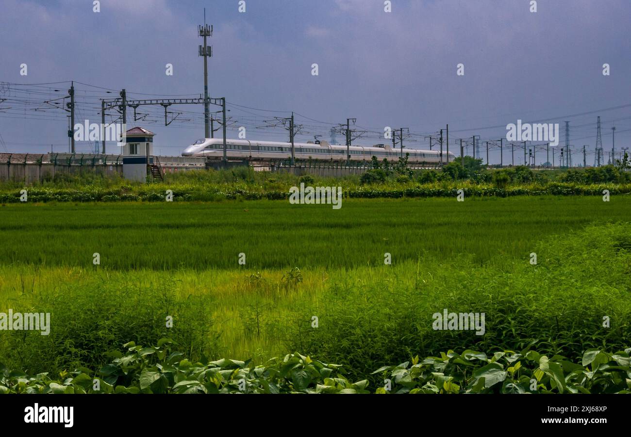 A Chinese CRRC built CRH380A bullet train leaves Jiaxing South Station ...